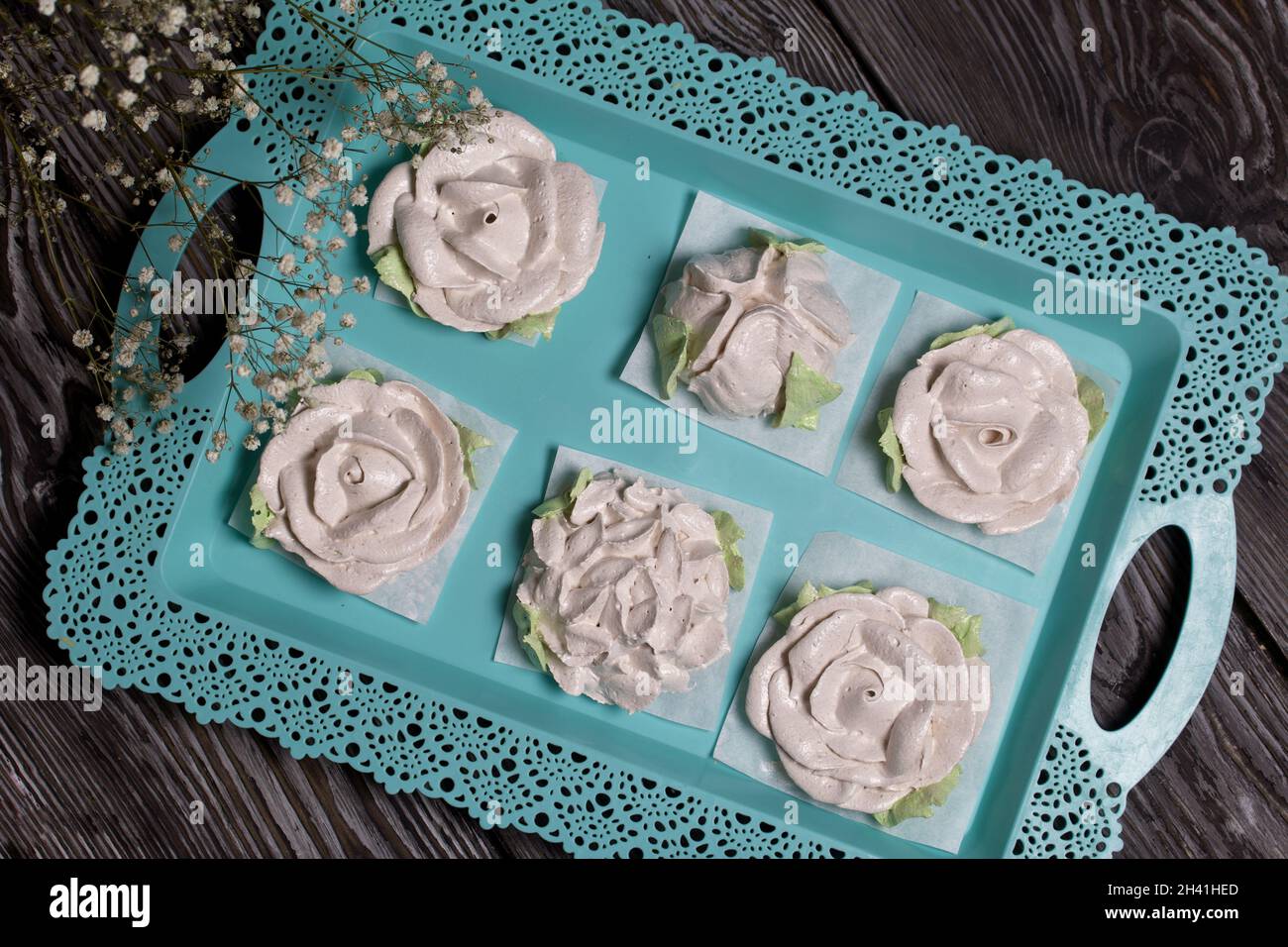 Homemade marshmallow. Zephyr roses. Marshmallow roses. Lies on a tray ...