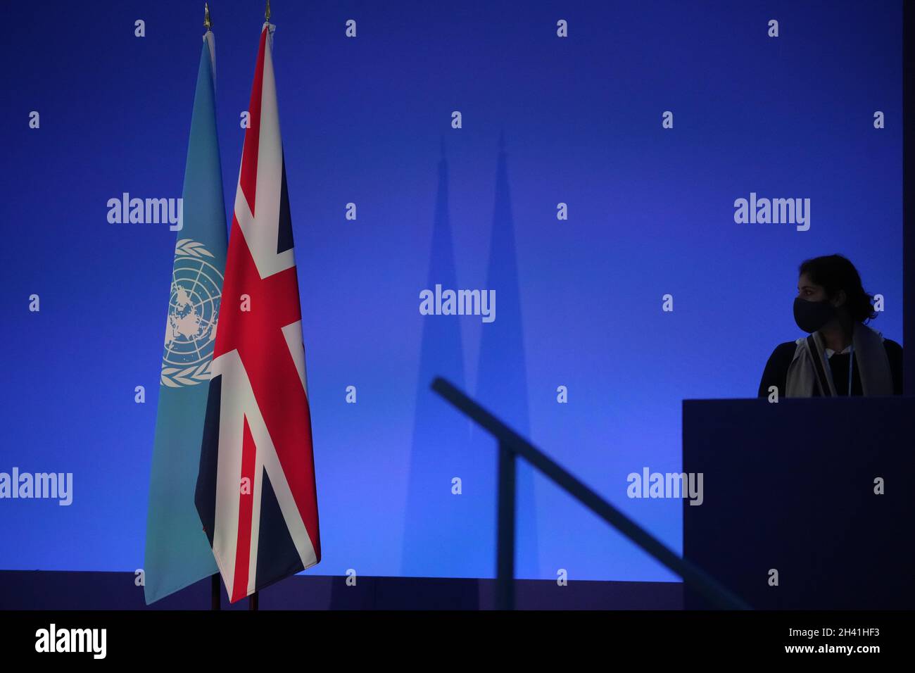 A Union Jack and United Nations flag are seen on the stage ahead of the ...