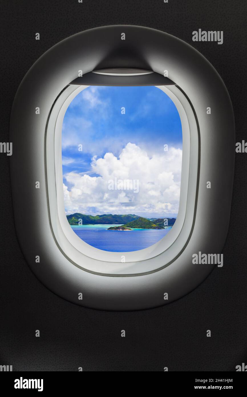 Island Praslin at Seychelles in airplane window Stock Photo - Alamy
