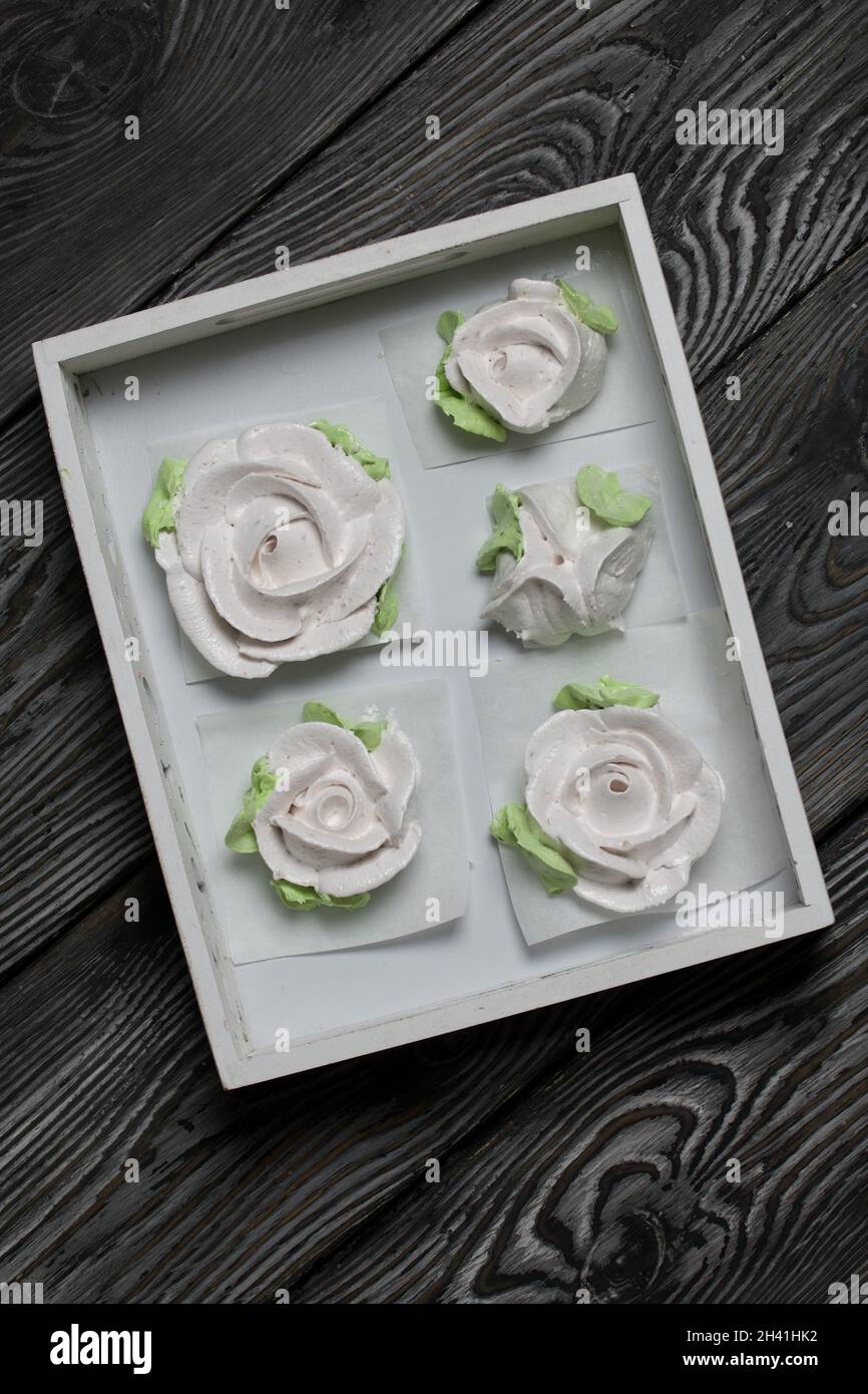 Homemade marshmallow. Zephyr roses. Marshmallow roses. Lies on a tray ...