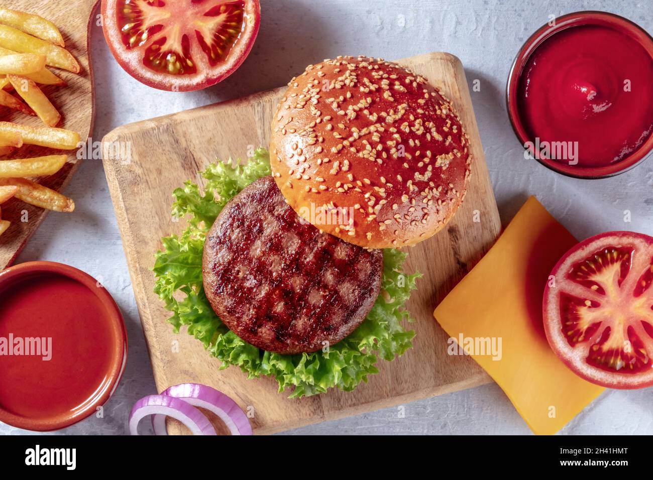 Beef burger ingredients, overhead flat lay shot with French fries Stock ...