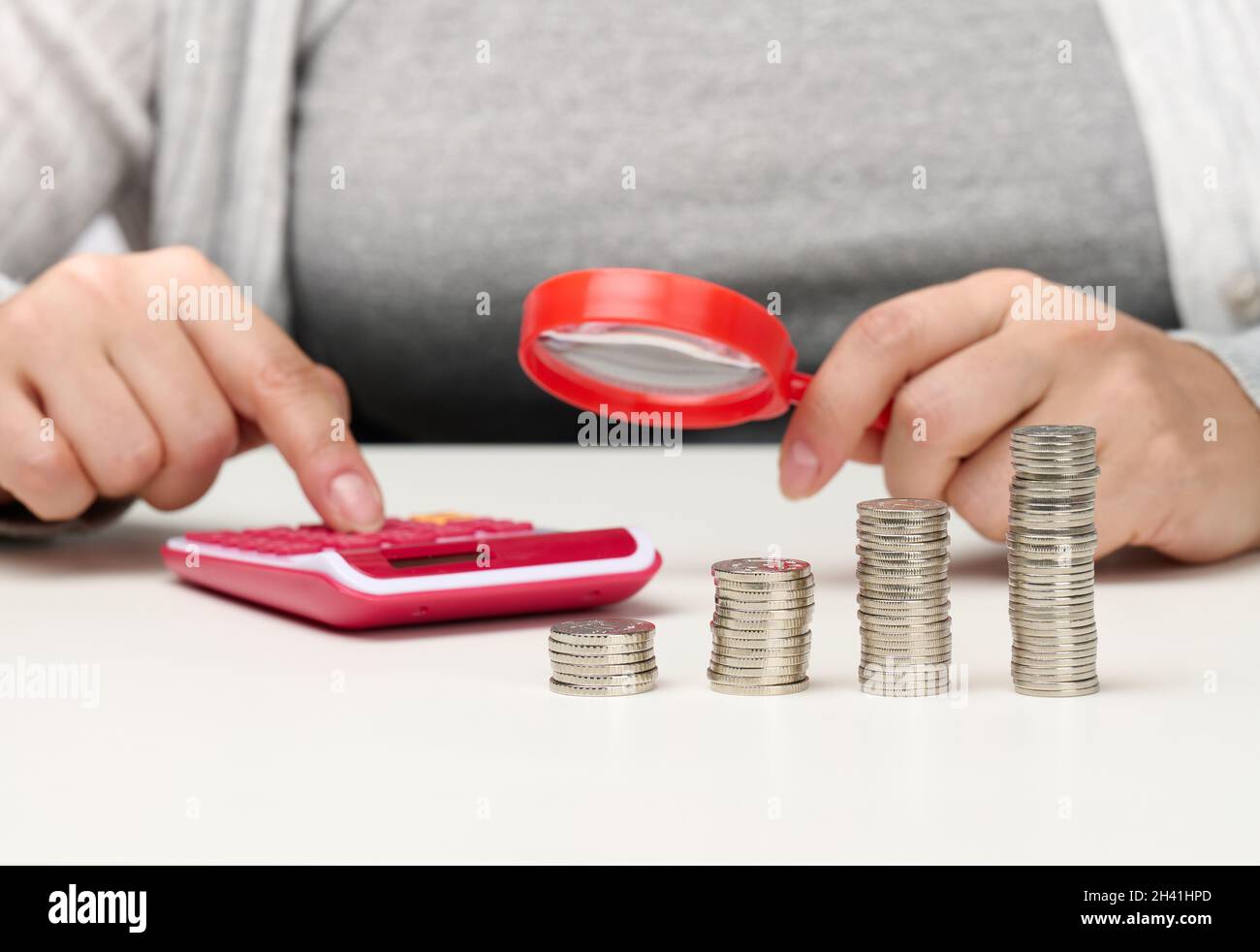 Calculat coins hi-res stock photography and images - Alamy