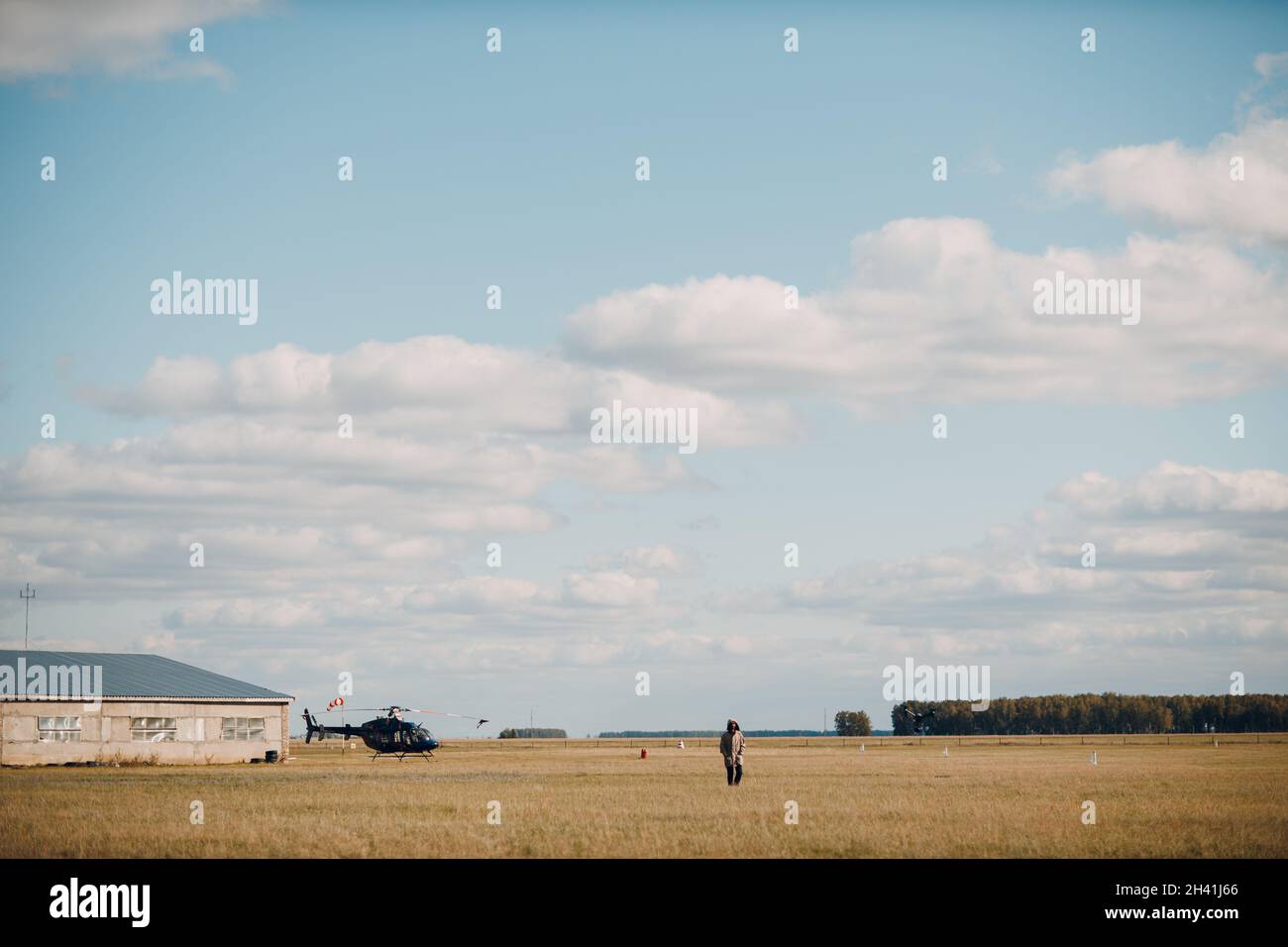 Big quadcopter drone on aerial flight and filming Stock Photo - Alamy