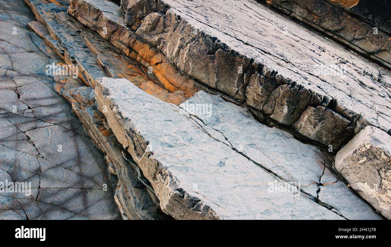 Cliff side Cornish rock face, highlighting erosion and sedimentary ...