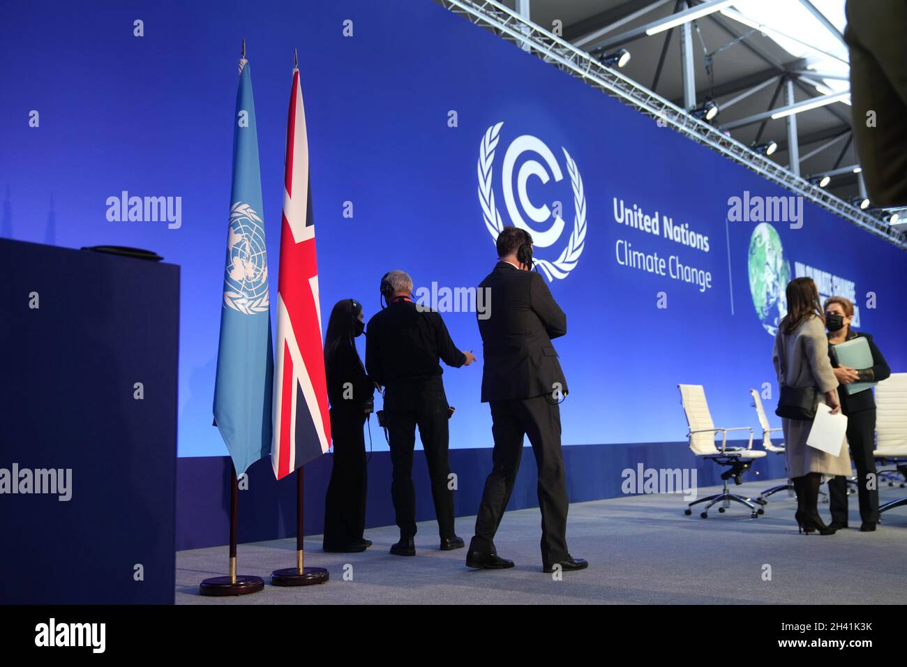 A Union Jack and United Nations flag are seen on the stage ahead of the ...
