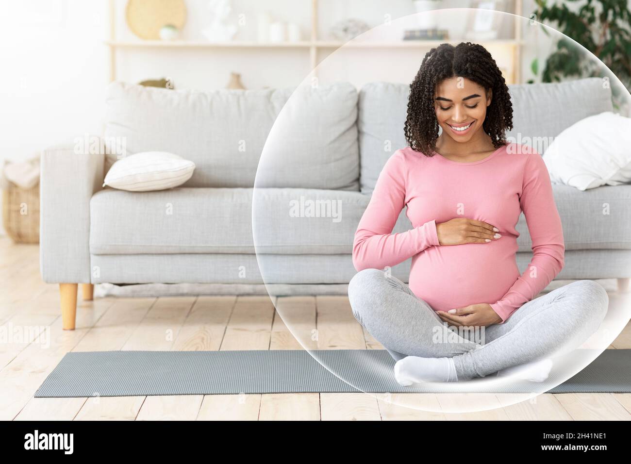 Happy Calm Young African American Pregnant Woman Meditating And