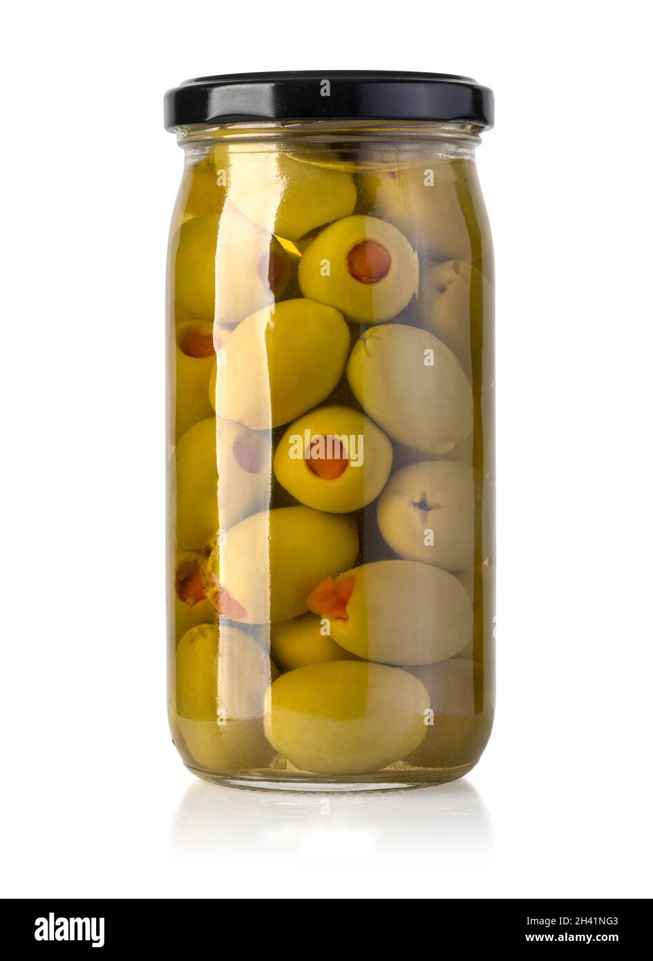 Stuffed green olives preserved in a glass jar isolated on white with ...