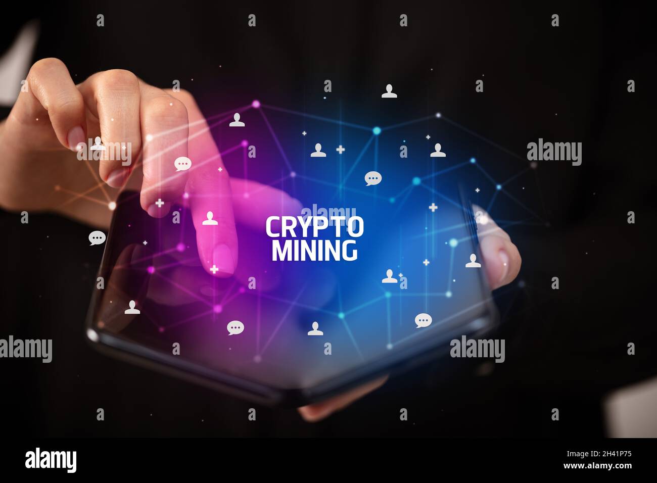 Businessman holding a foldable smartphone with CRYPTO MINING ...
