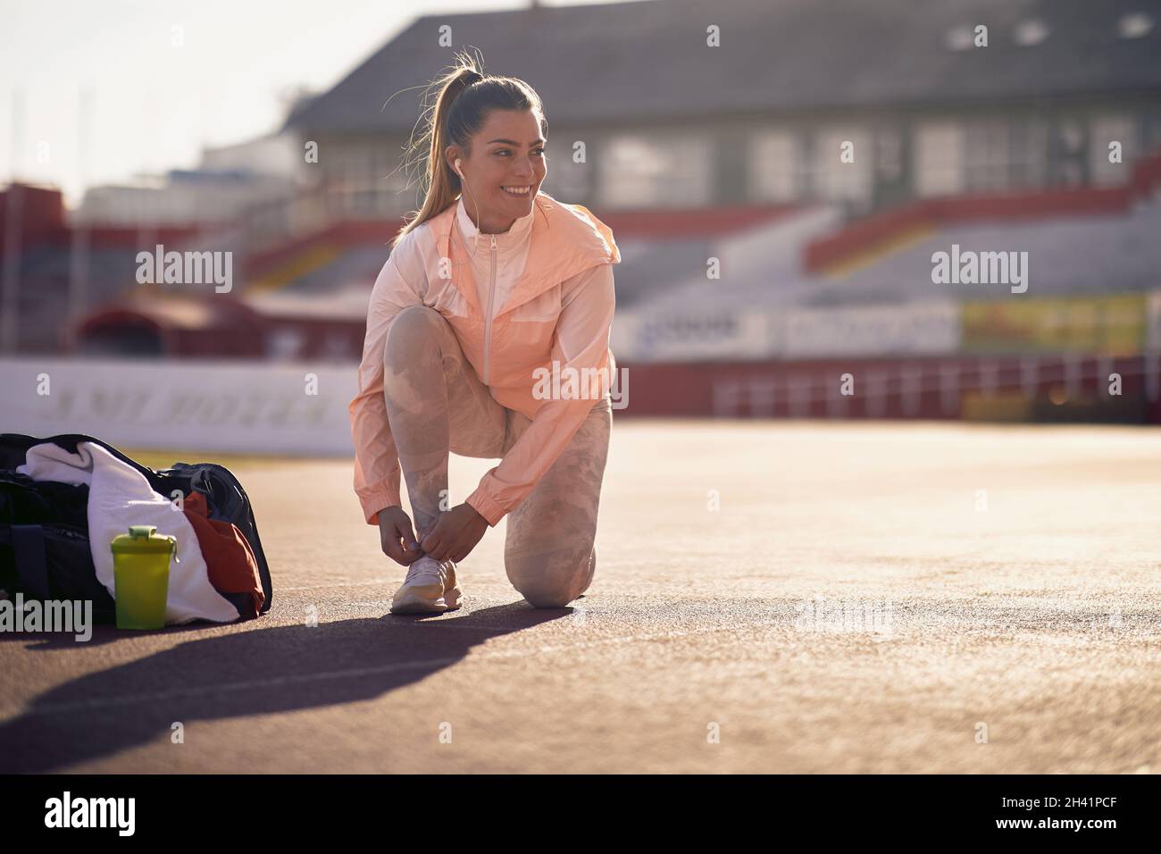 beautiful young adult caucasian female kneeling on one knee at the ...
