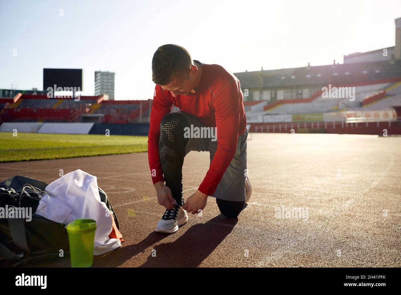 Professional athlete preparing for the race on the stadium Stock Photo ...