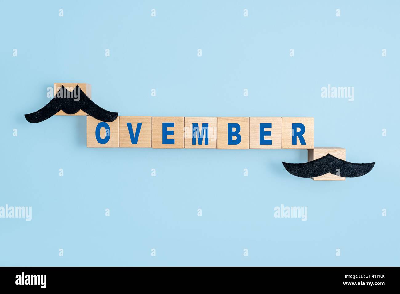 Word MOVEMBER and mustaches on blue background Stock Photo - Alamy