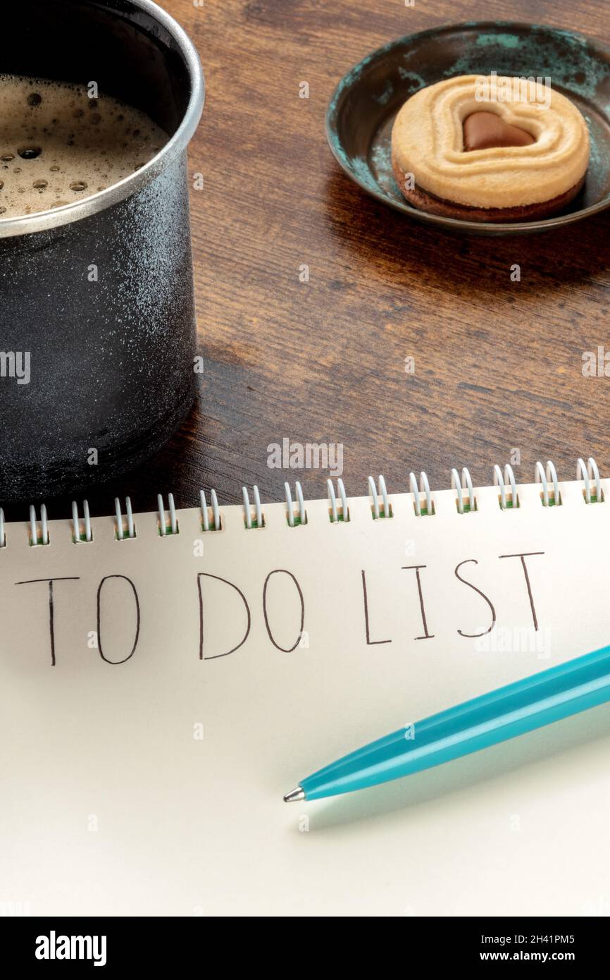 To Do List, handwritten words on a paper notepad, with a turquoise blue ...