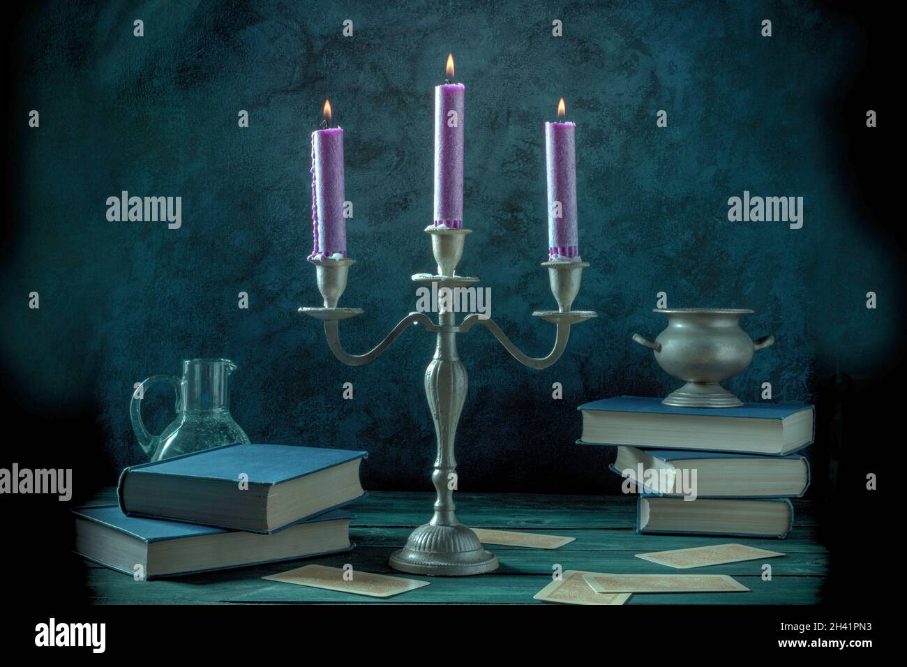 Magic and divination. Purple candles, magick potions, etc Stock Photo ...