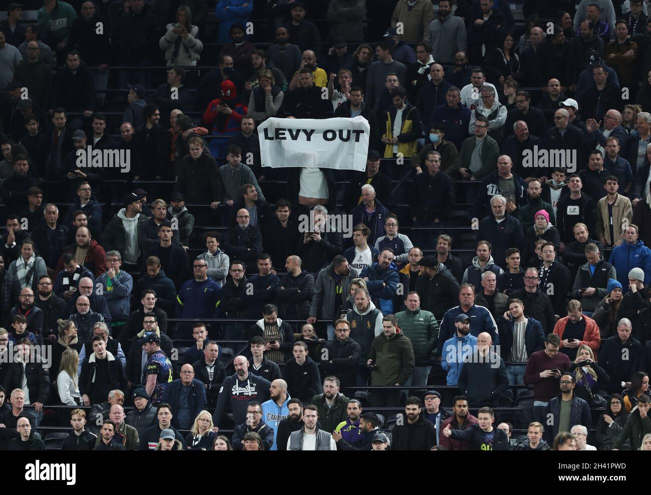 LONDON, ENGLAND - OCTOBER 30: A Tottenham Hotspur fan holds up a Levy ...