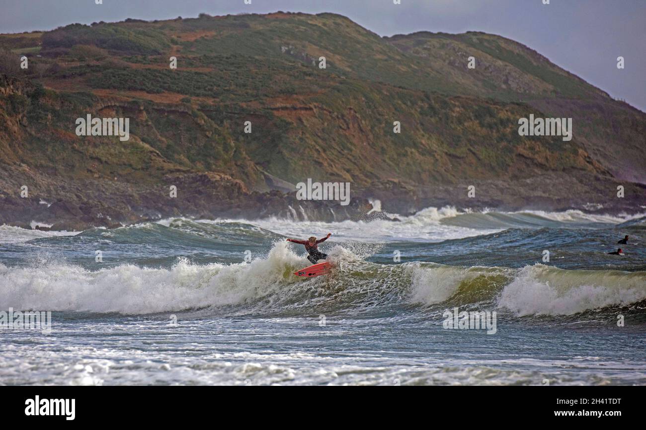 Swansea, UK. 31st Oct, 2021. Surfers enjoying the waves at Langland Bay ...