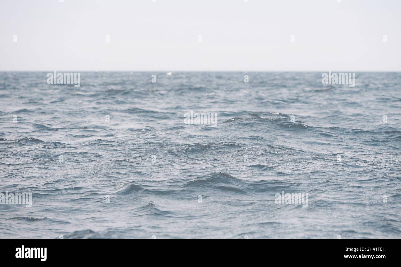 Horizon sea with waves after storm. sparkler in water - background. sea ...