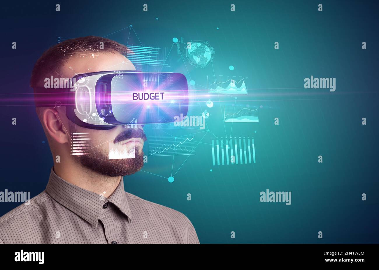 Businessman looking through Virtual Reality glasses Stock Photo - Alamy