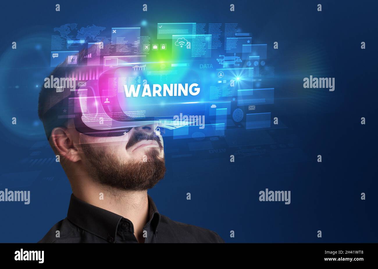 Businessman looking through Virtual Reality glasses Stock Photo - Alamy