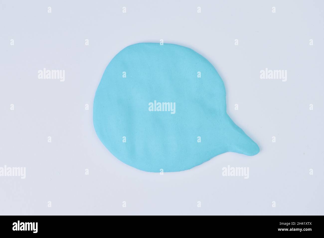 blank blue speech bubble for any text on white paper Stock Photo - Alamy
