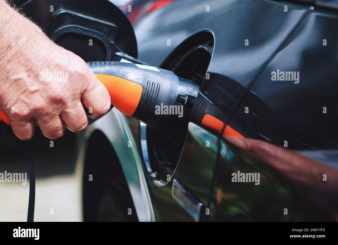 E-Mobility, Charging an electric car Stock Photo - Alamy