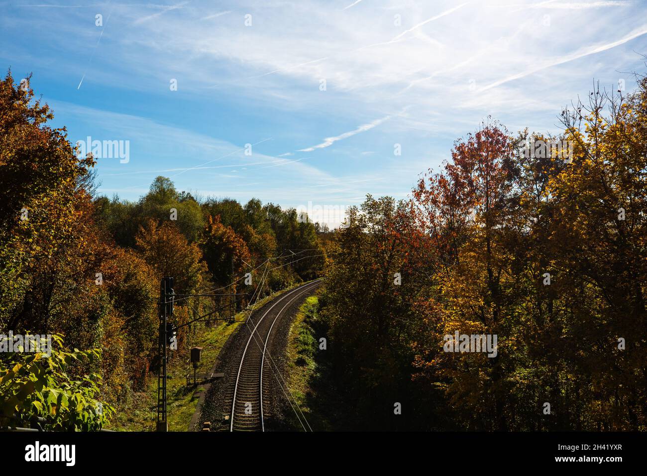 Train tracks in autumn, sunshine Stock Photo - Alamy