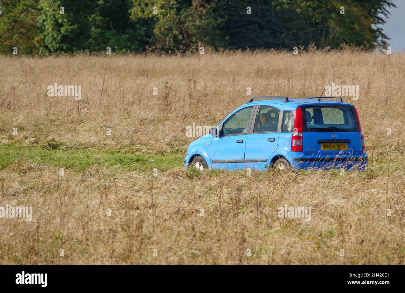 light blue fiat panda dynamic motor car driving across Salisbury Plain ...