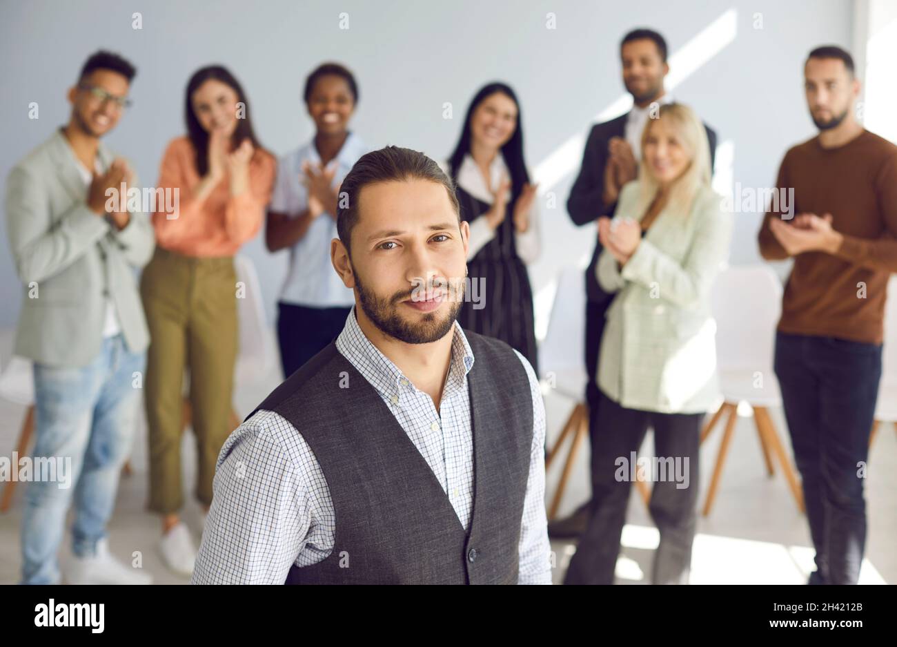 Portrait of successful and smart young man on blurred background of ...