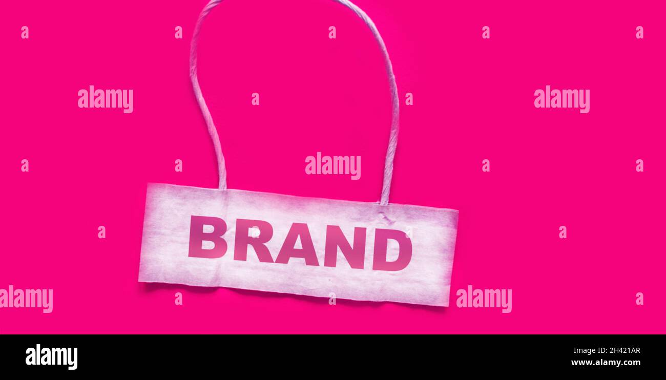 Brand, text on business card and pink background. Business handwriting ...