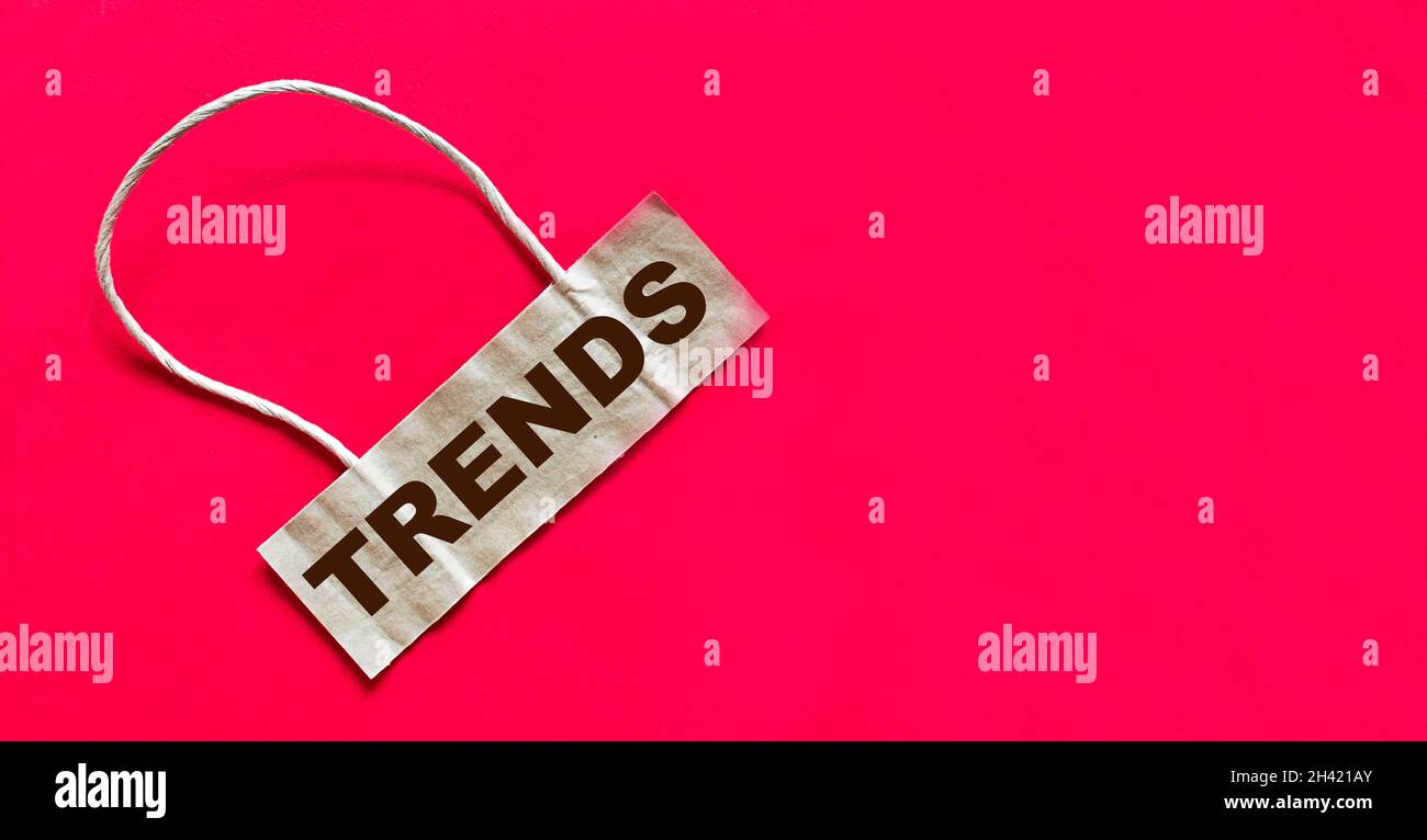 Trends is written on a brown note and a red background. Business ...