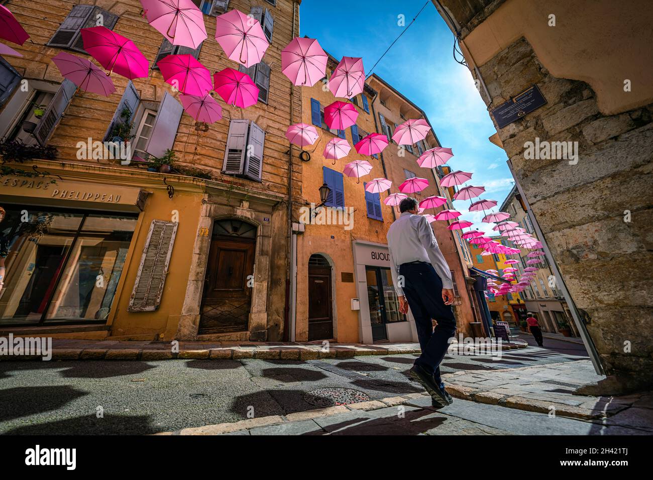 Grasse France pink umbrellas decoration Stock Photo - Alamy