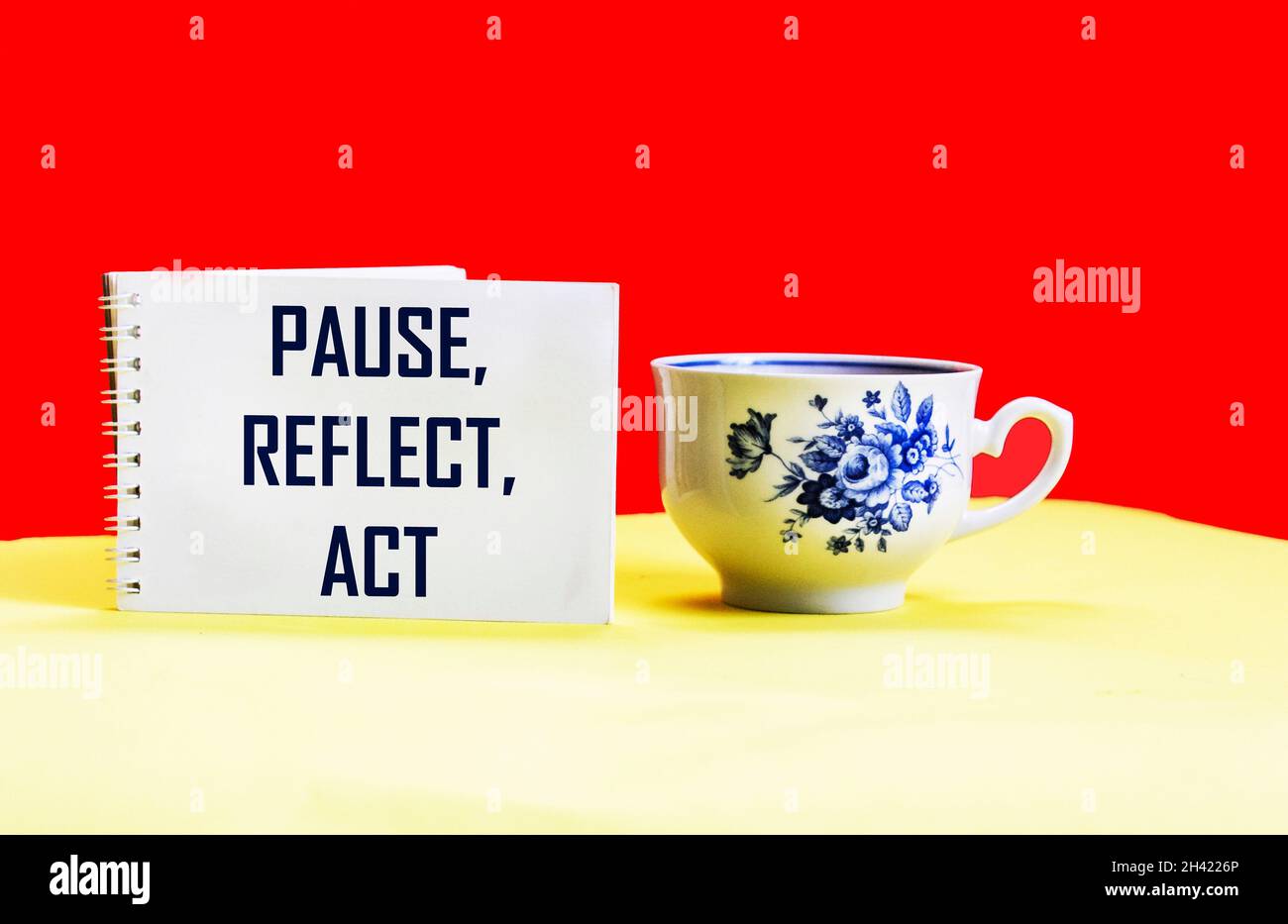 pause, meditation, action concept - abstract word on notepad with a cup ...
