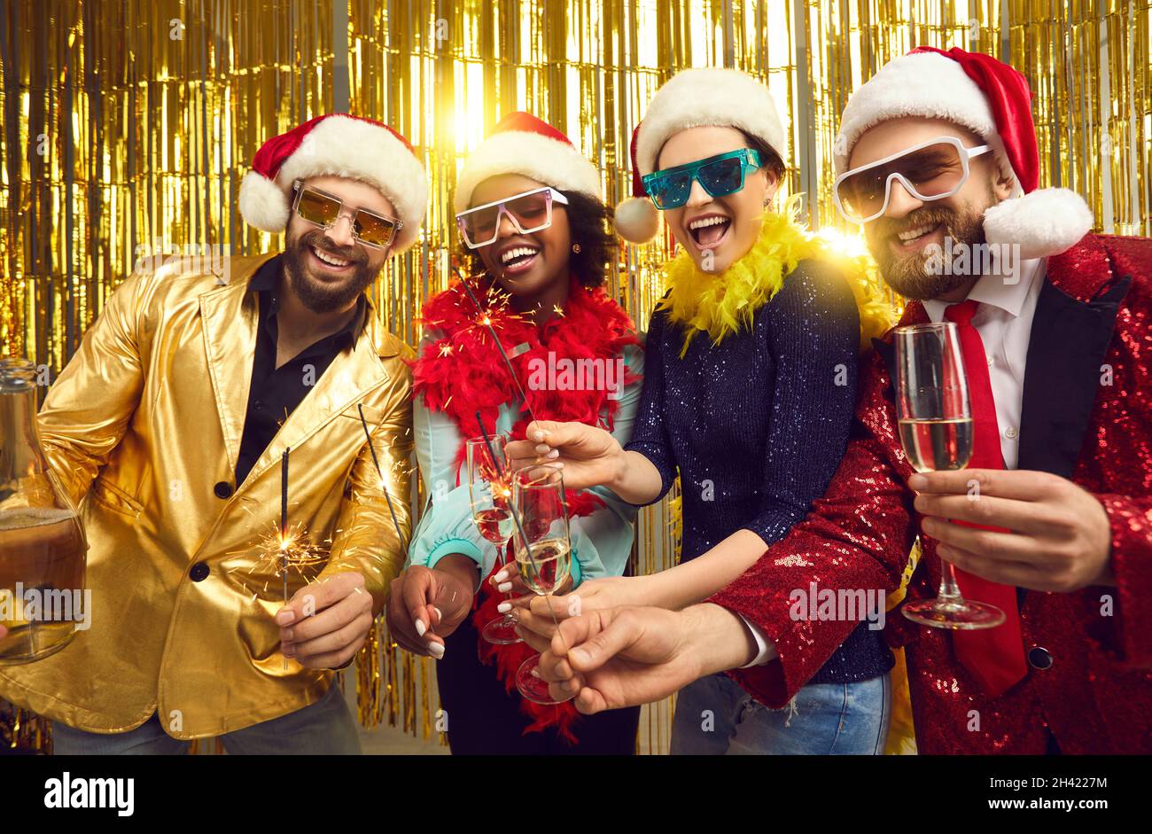 Happy friends merry christmas people group in party santa hat posing ...