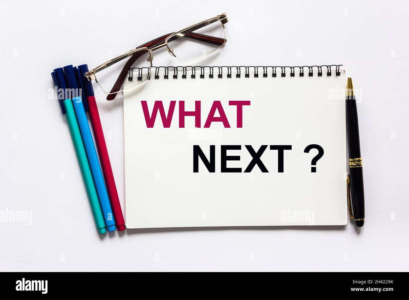 Text written on notepad What's Next, concept on a white background ...