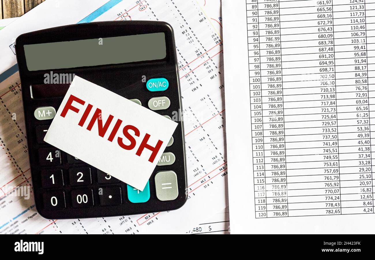 The word FINISH is written on the calculator display. There are ...