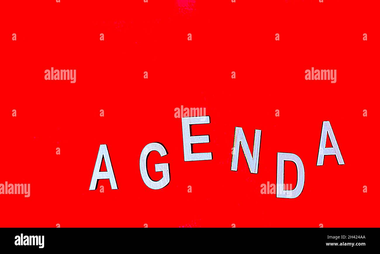 On a red background, rustic letters with the word Agenda on a red ...