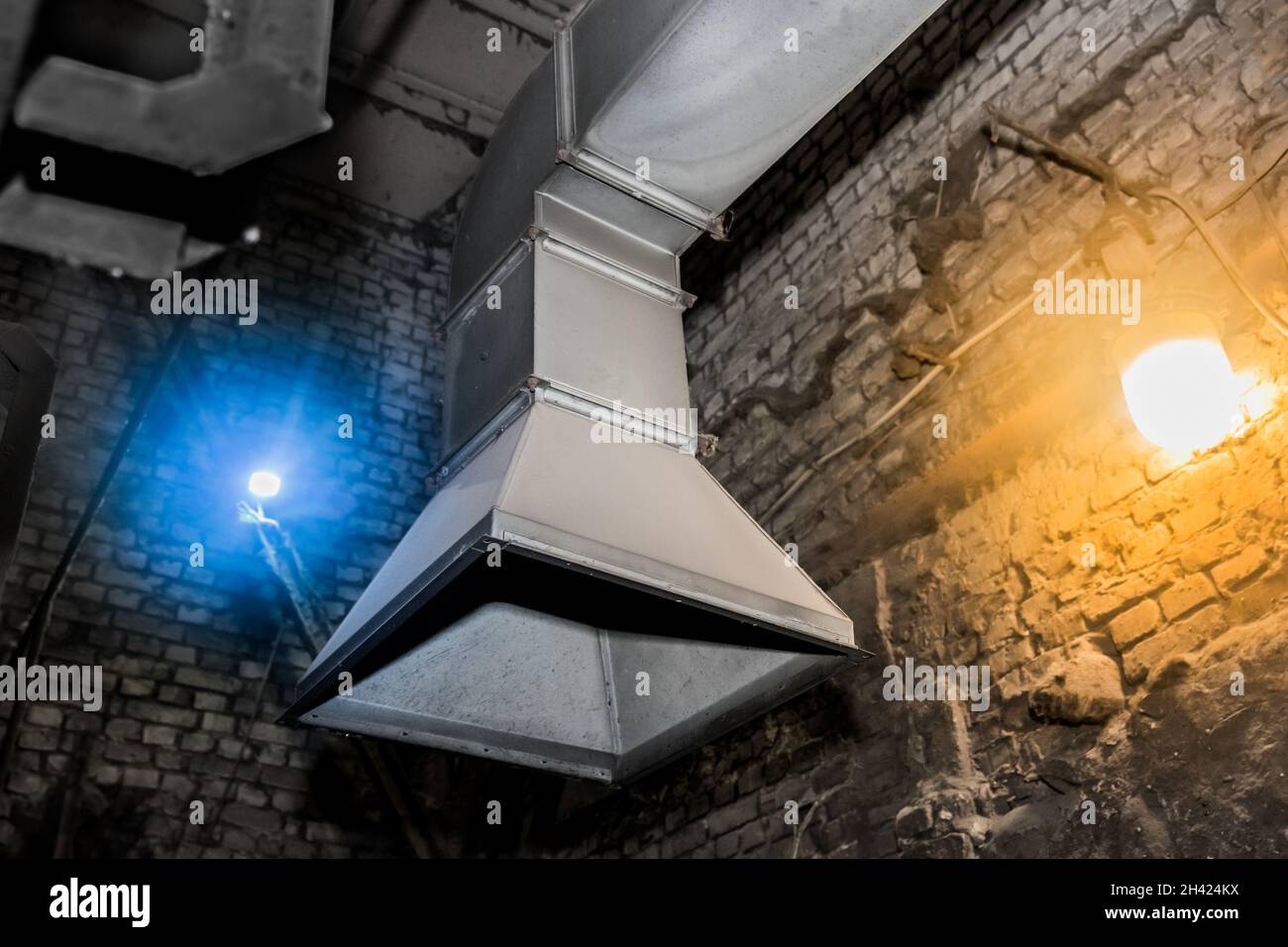 Large ventilation system pipe in the premises of the old industrial ...