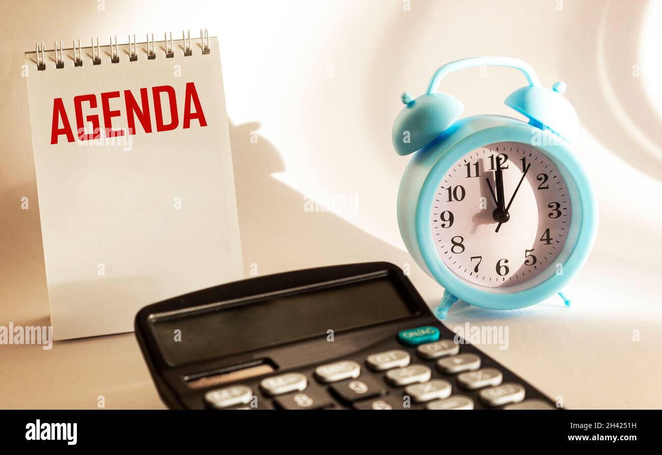 Business agenda, planning concept. Spiral notebook with Agenda text on ...