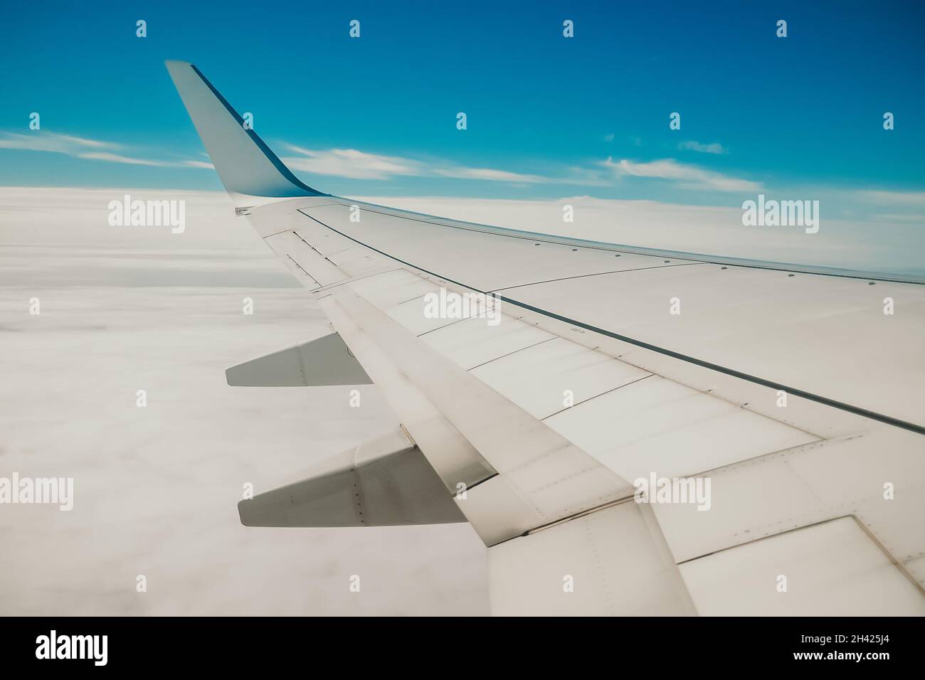 View from jet to sky with clouds. Camera filming from aircraft porthole ...