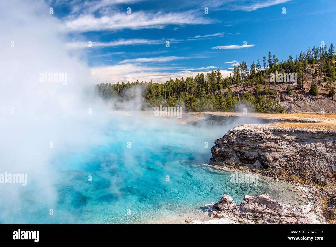 Bright azure colored hot pool in Yellowstone National Park, USA Stock ...