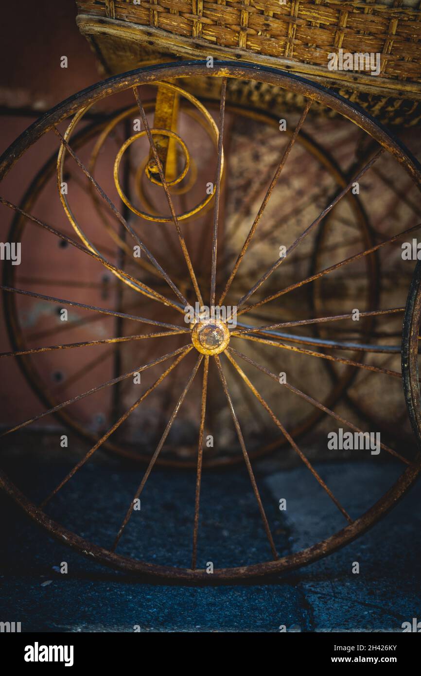 A vertical shot of a metal wheel of a cart Stock Photo - Alamy