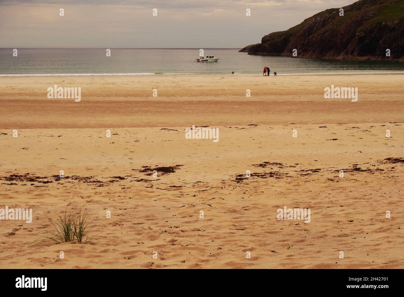 Looking out to sea at Polin Bay, Sutherland, Scotland, across the sand ...
