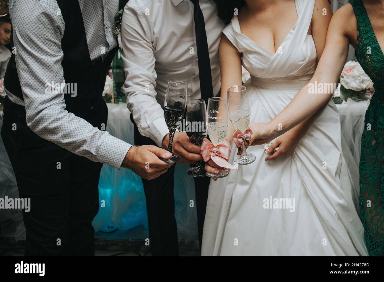 A beautiful shot in the wedding of bride and groom with guests ...