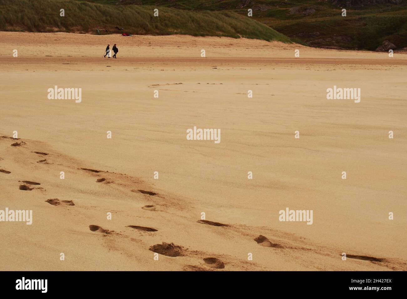 A low down view across the sands at Polin Bay, Sutherland, Scotland ...
