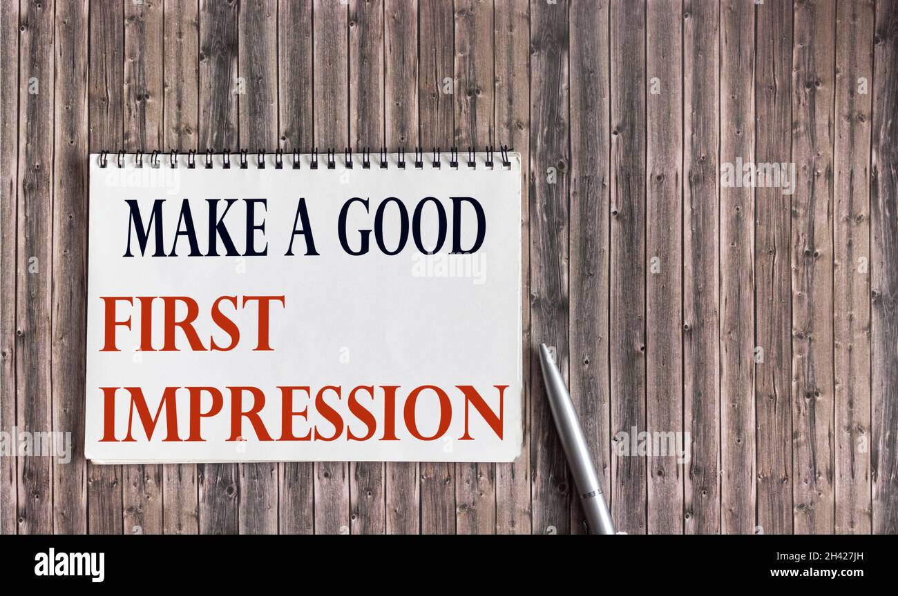 Make a good first impression written on notepad and wooden table Stock ...
