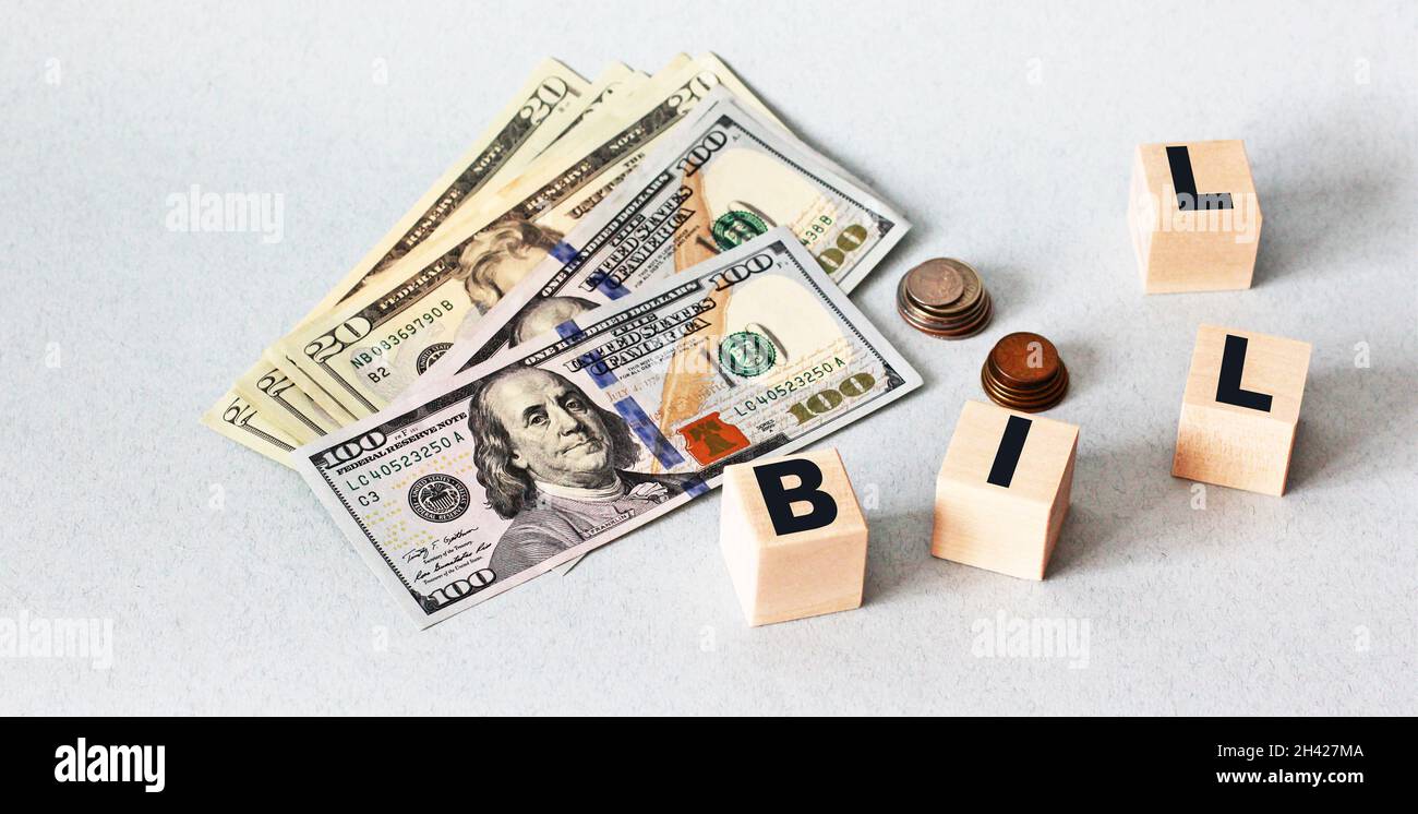 Concept - text bill with wooden light cubes with cash bill Stock Photo ...