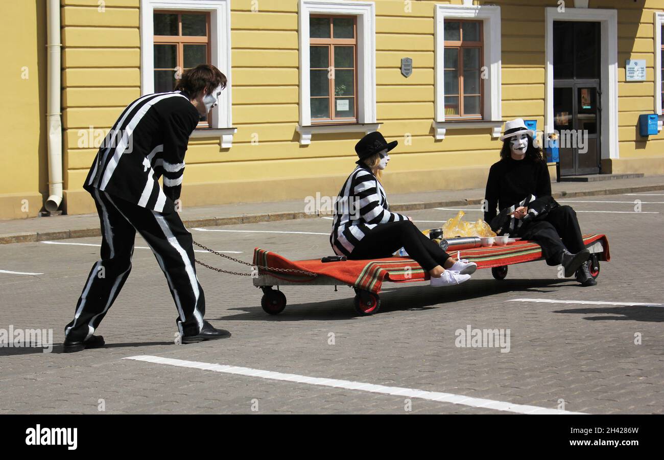 May 2, 2015. Minsk, Belarus. Clowns ride a cart through the city. Three ...