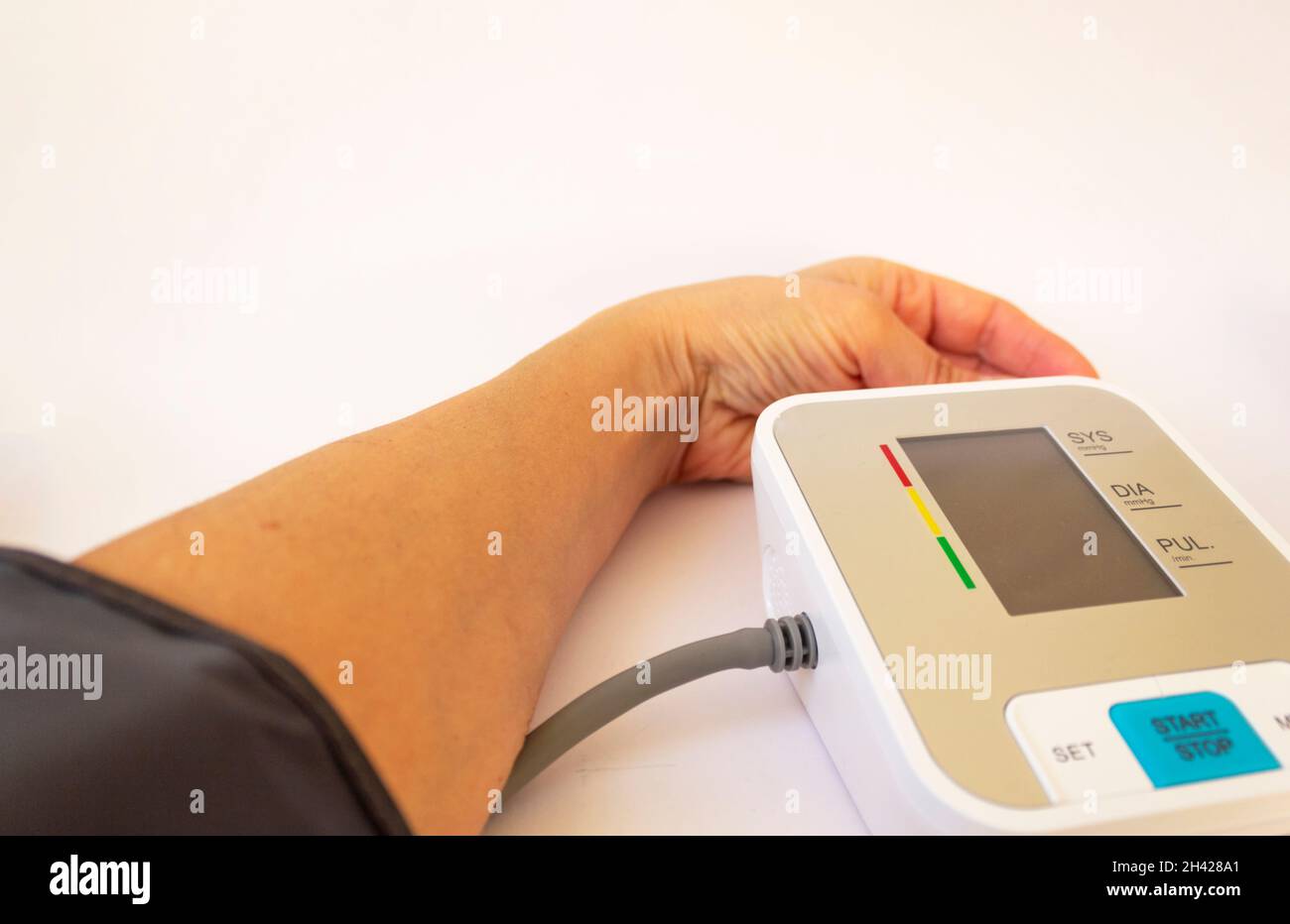 Female hands with blood-pressure meter isolated over white Stock Photo ...