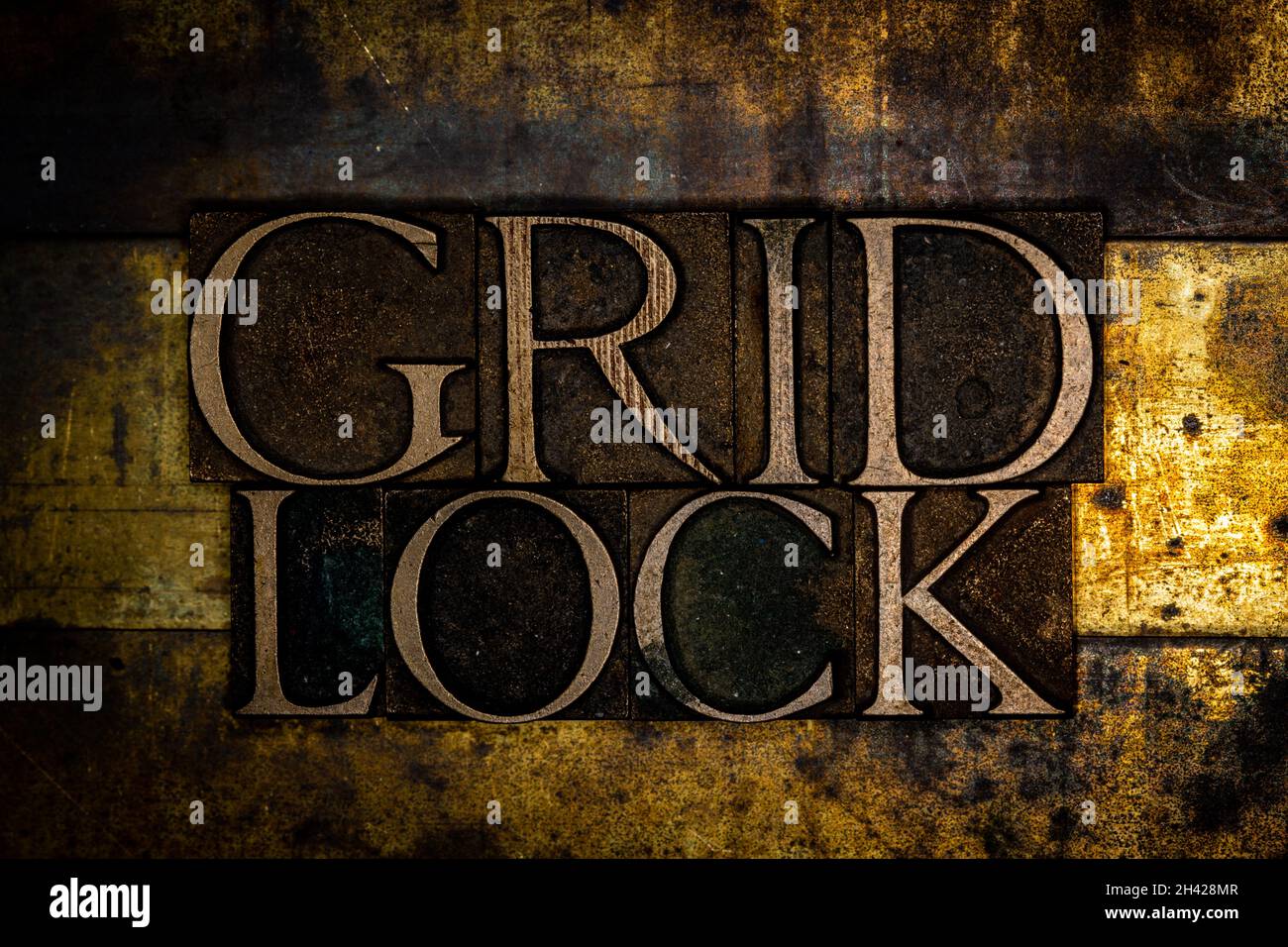 Grid Lock text message on textured grunge copper and vintage gold ...