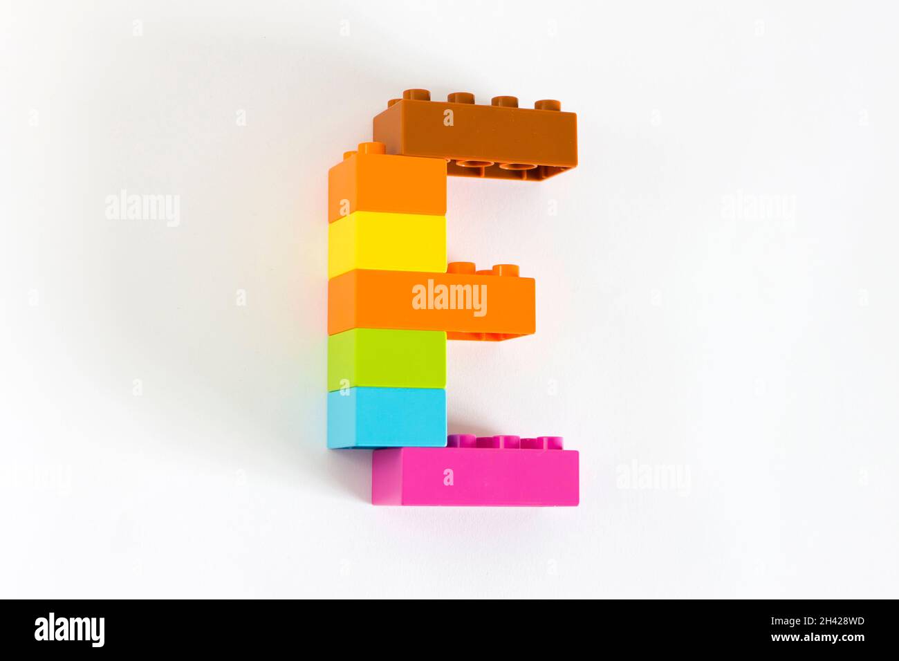 Colorful toy brick letter E isolated on the white background Stock ...