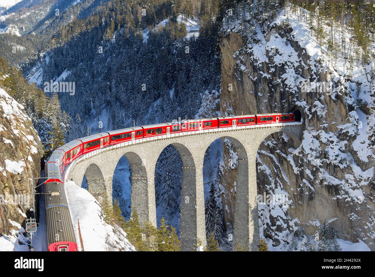 Filisur, Switzerland - January 19. 2019: A red passenger Swiss train ...